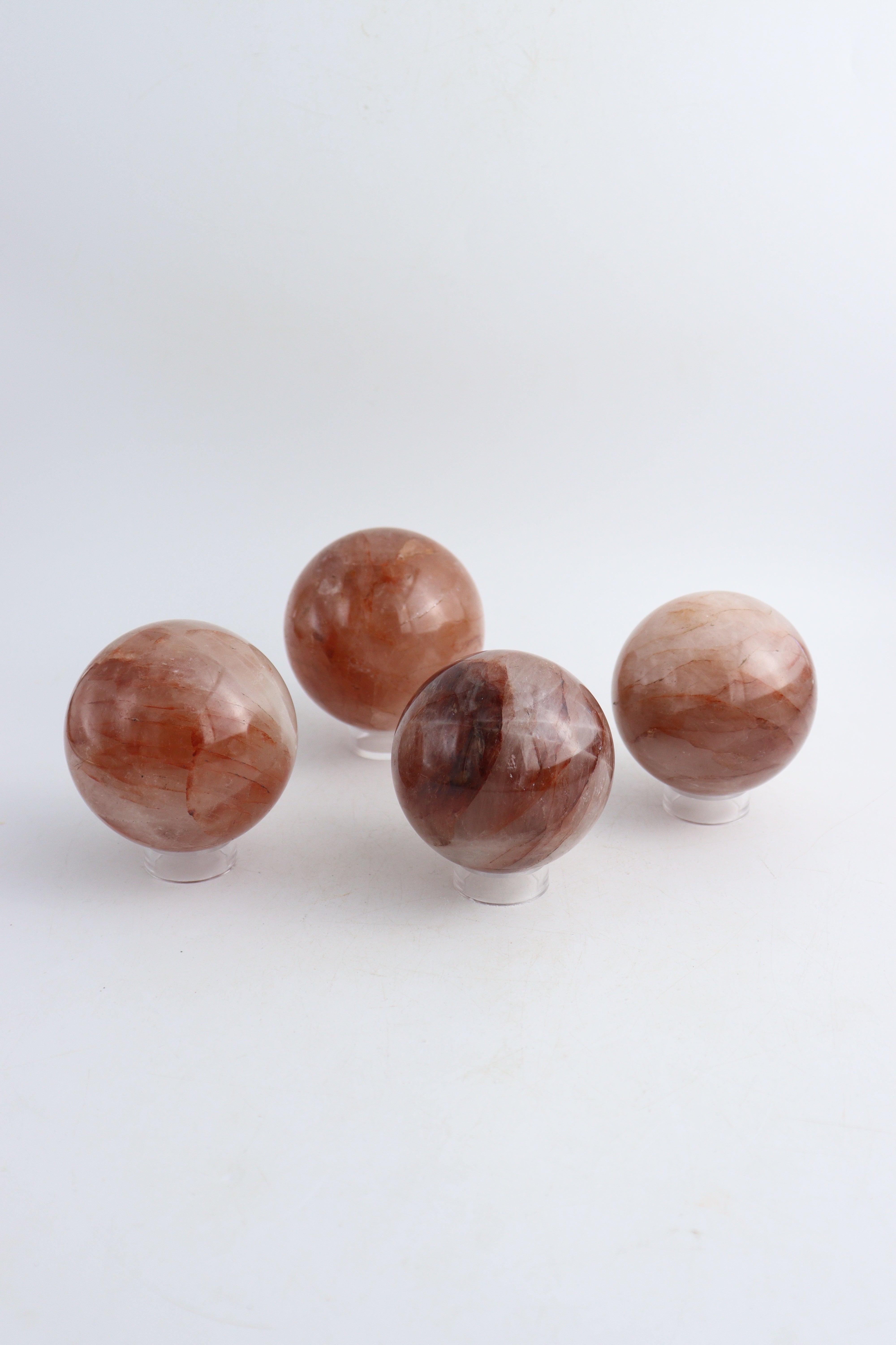 Fire Quartz Spheres Set of 4 | Wholesale Crystals – Mi Esperanza Minerals